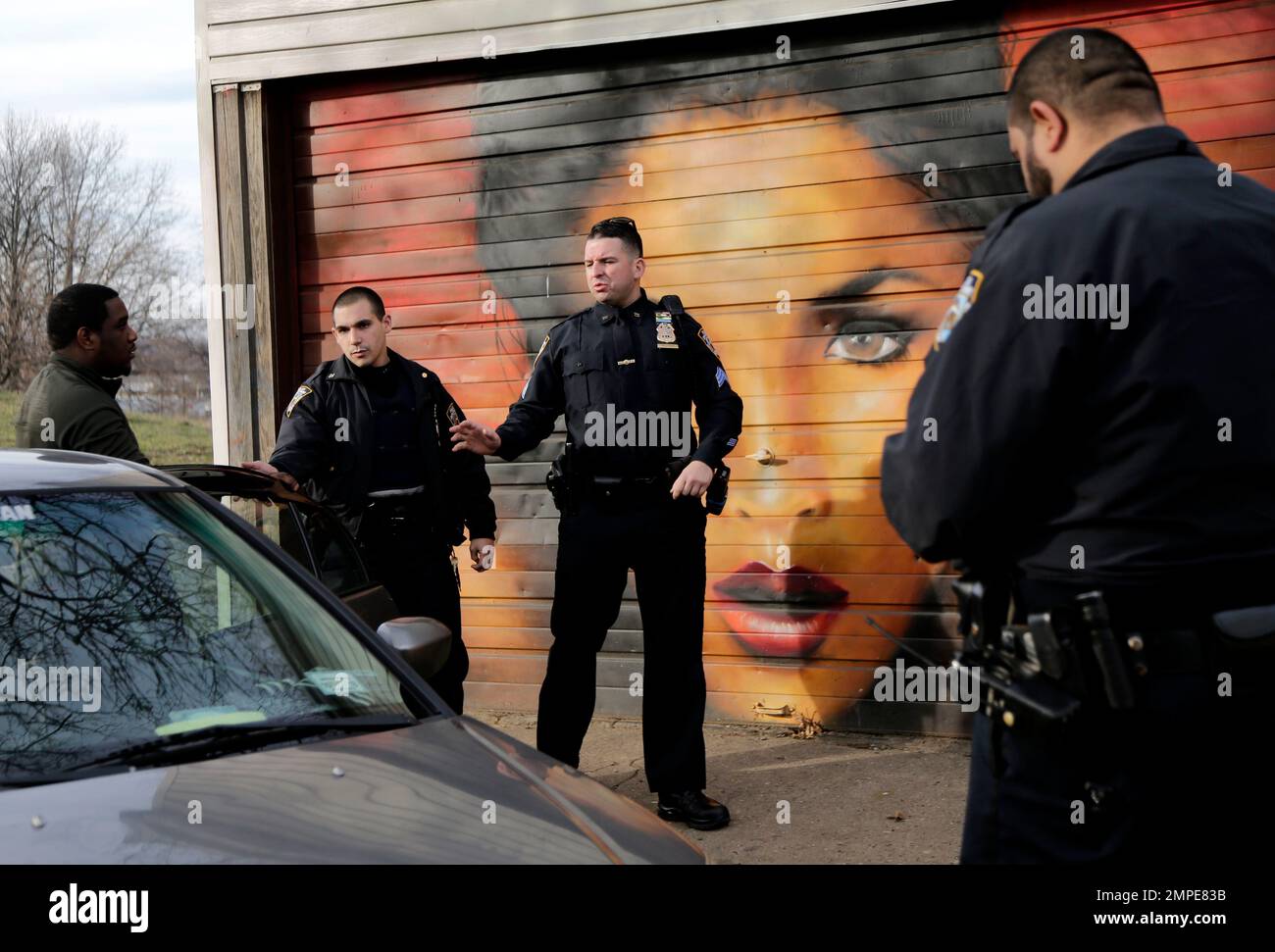 In this Tuesday, Dec. 19, 2017 photo, police officers Jimmy Priore ...