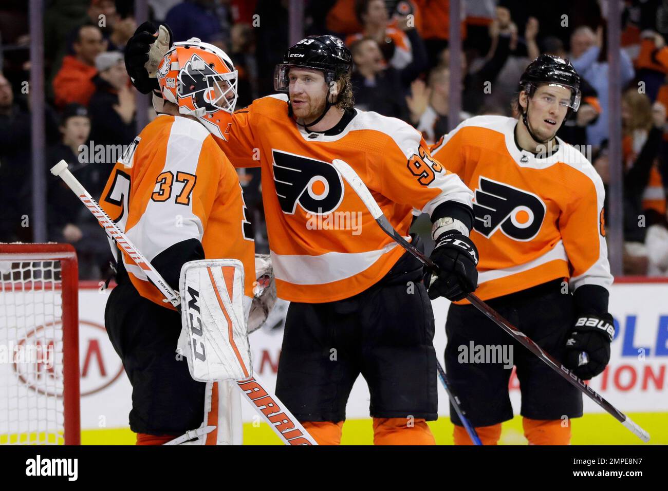 Philadelphia Flyers' Brian Elliott (37), Jakub Voracek (93) and Robert ...