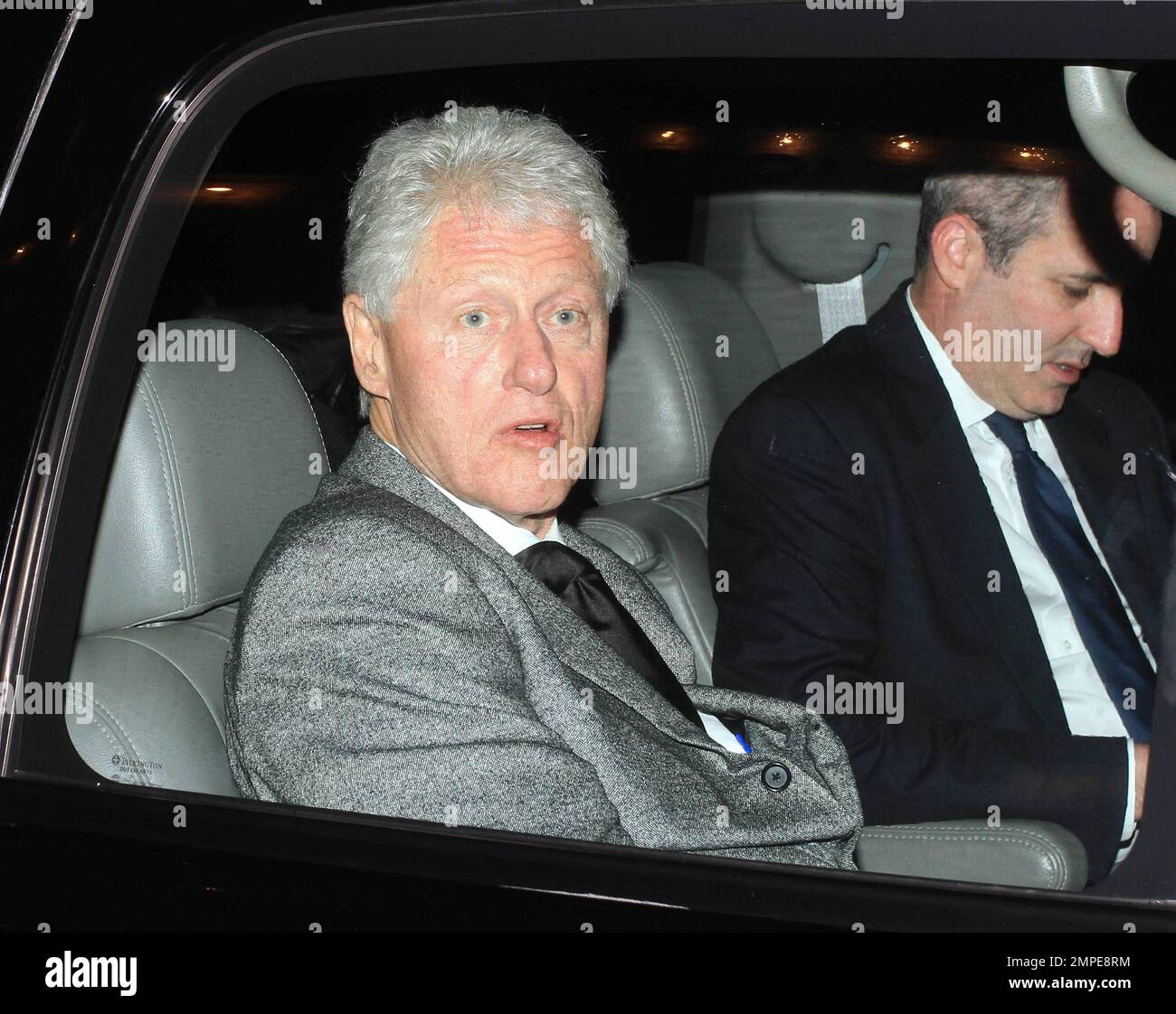 Former US president Bill Clinton does a lot of handshaking and smiling ...