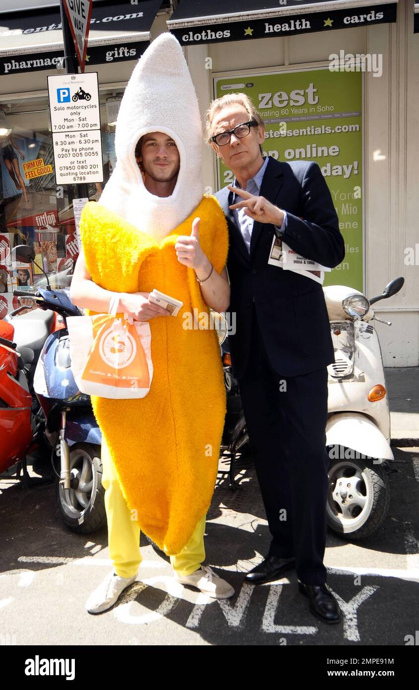 UK actor Bill Nighy talks to a man in a banana costume outside a ...