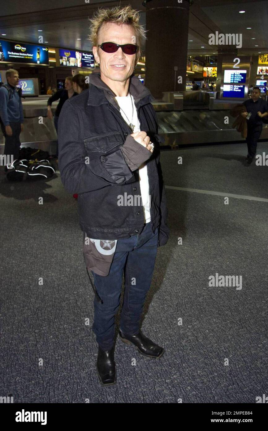 Exclusive!! Rocker Billy Idol arrives at McCarran International Airport ...