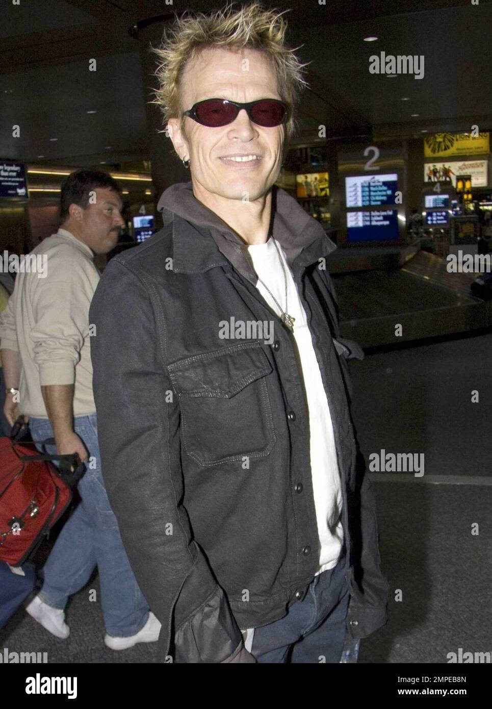 Exclusive!! Rocker Billy Idol arrives at McCarran International Airport ...
