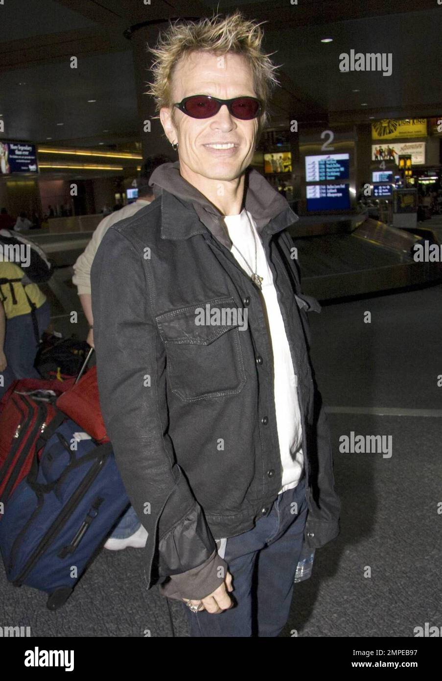 Exclusive!! Rocker Billy Idol arrives at McCarran International Airport ...