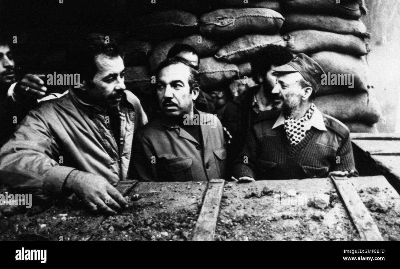 PLO Chairman Yasser Arafat, right, inspects a sandbagged position in ...
