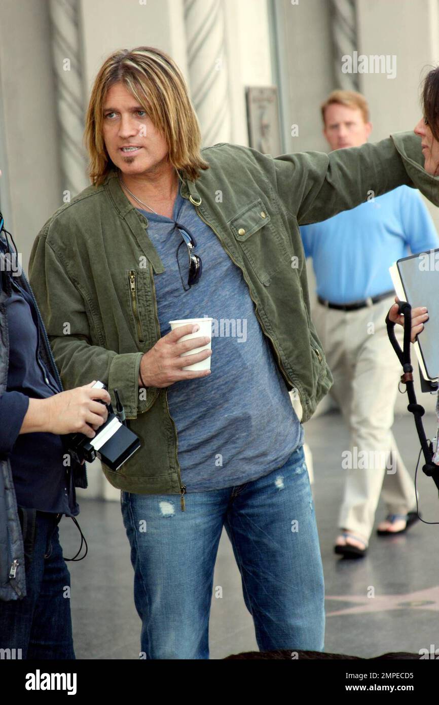 Billy Ray Cyrus poses up with his dog in Hollywood. His hound is ...