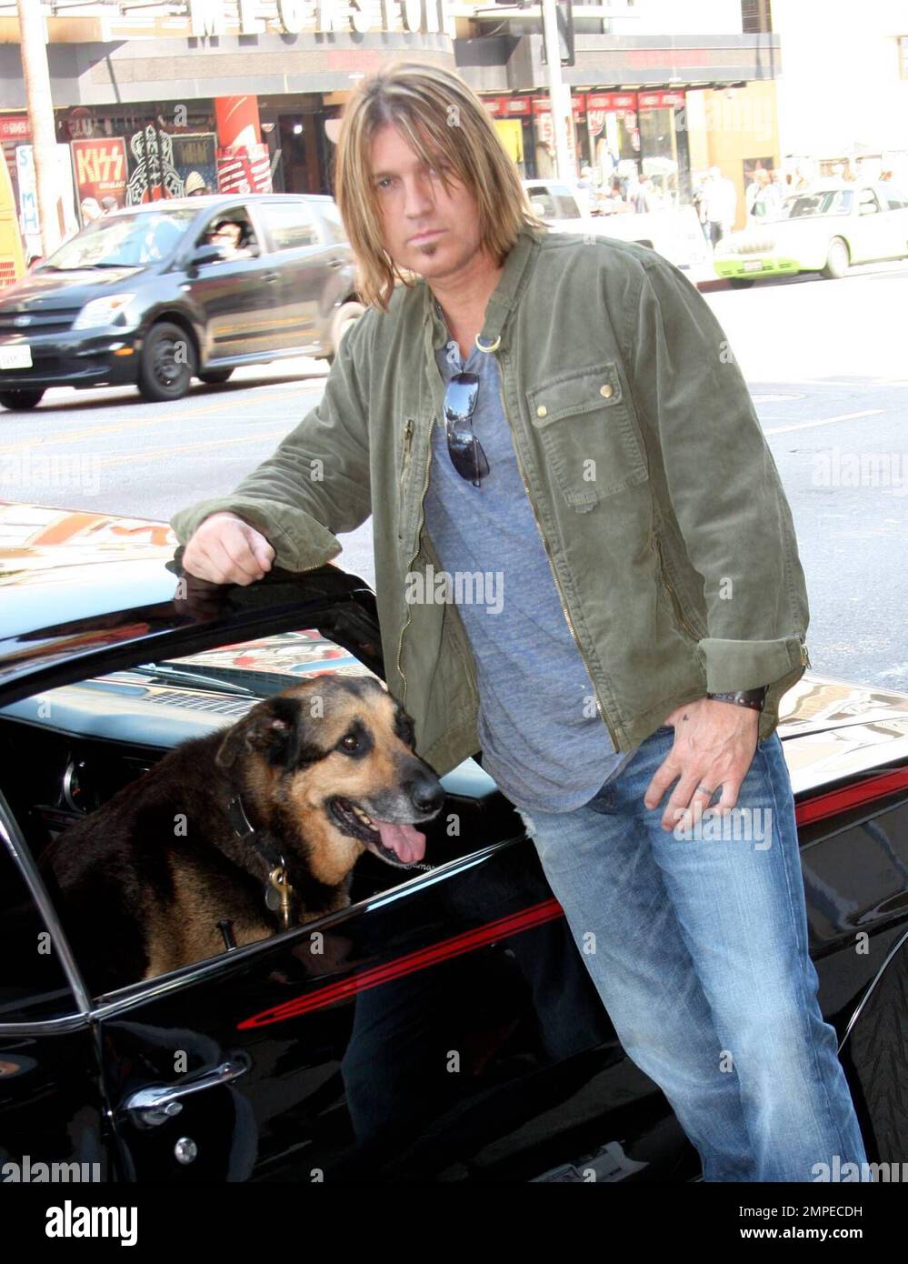Billy Ray Cyrus poses up with his dog in Hollywood. His hound is ...