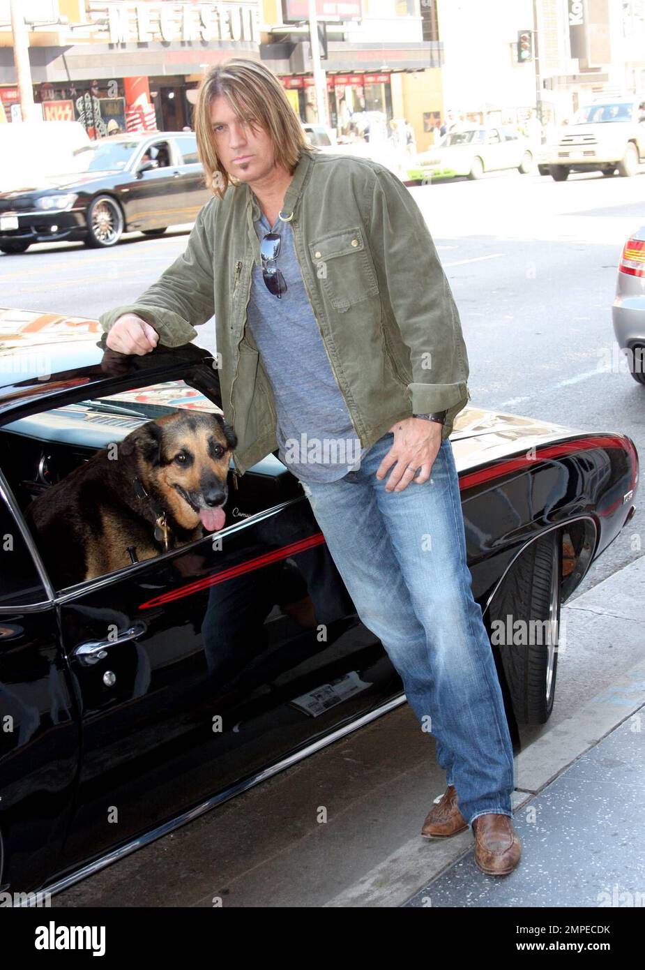 Billy Ray Cyrus poses up with his dog in Hollywood. His hound is ...