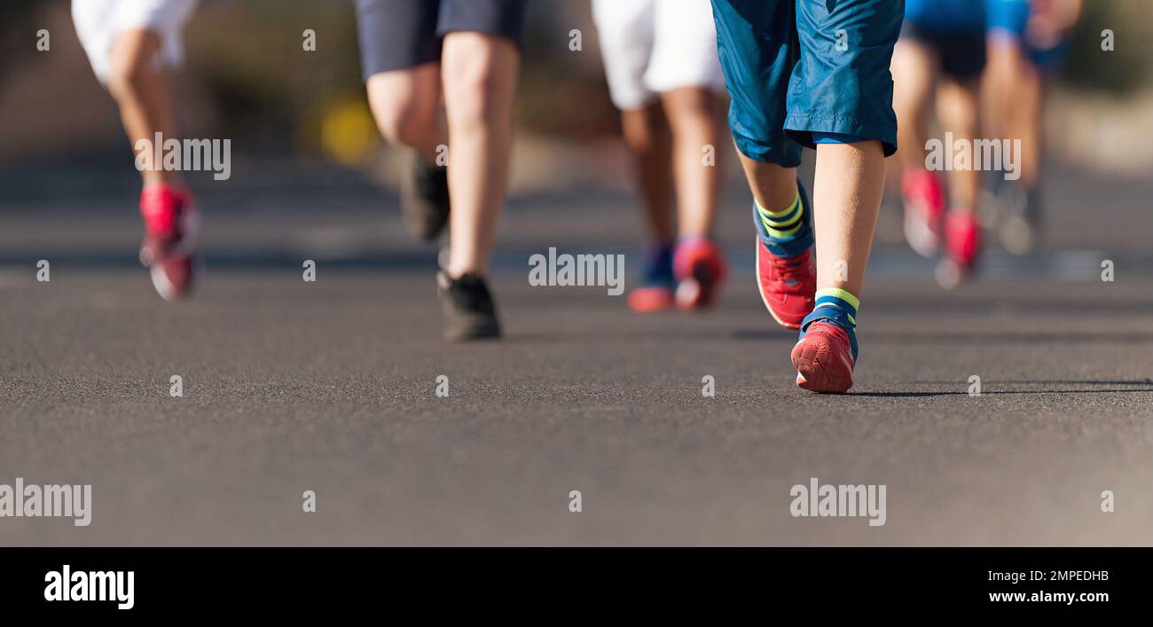 Running children, young athletes run in a kids run race,running on city ...