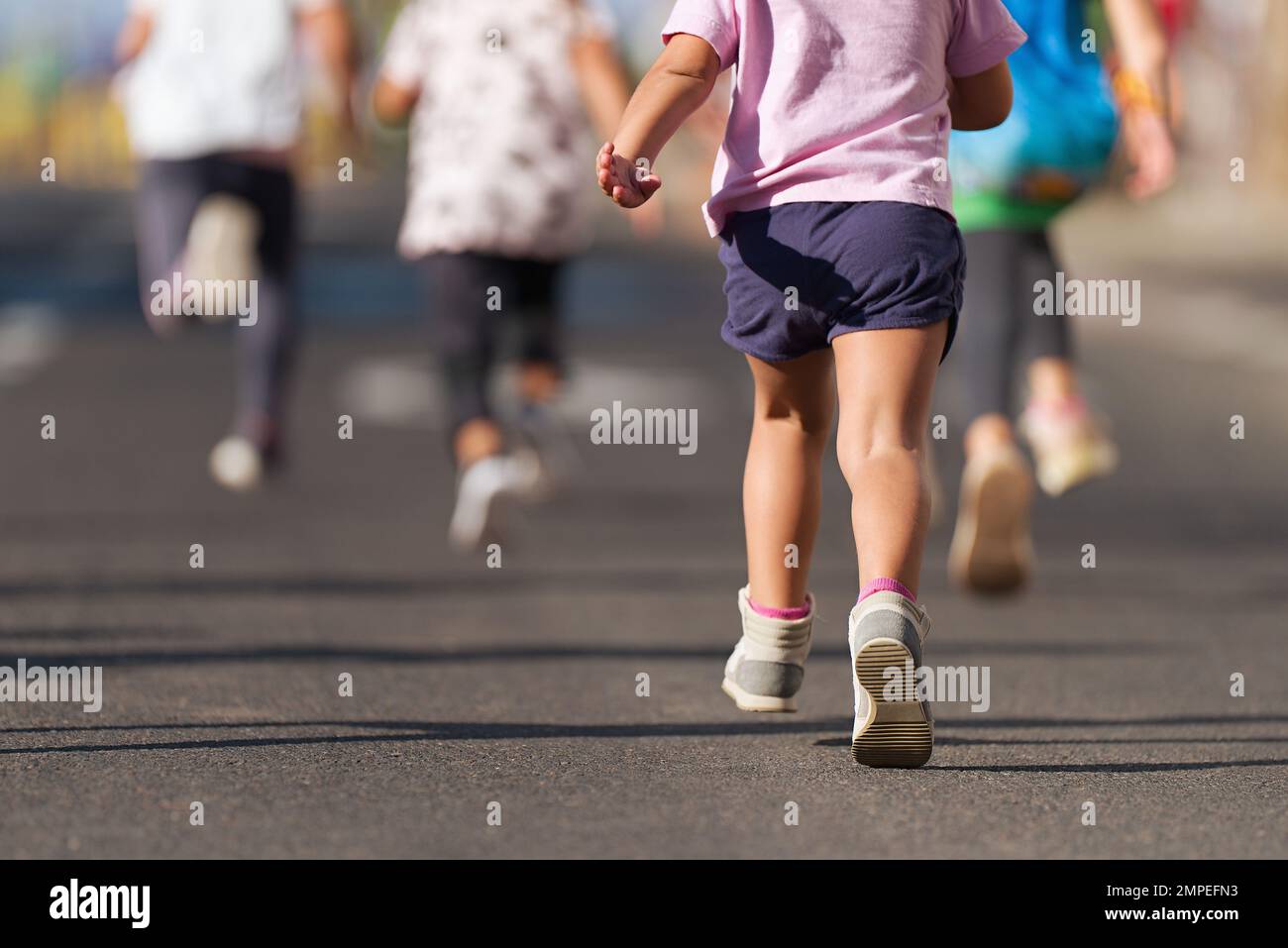 Running children, young athletes run in a kids run race,running on city ...