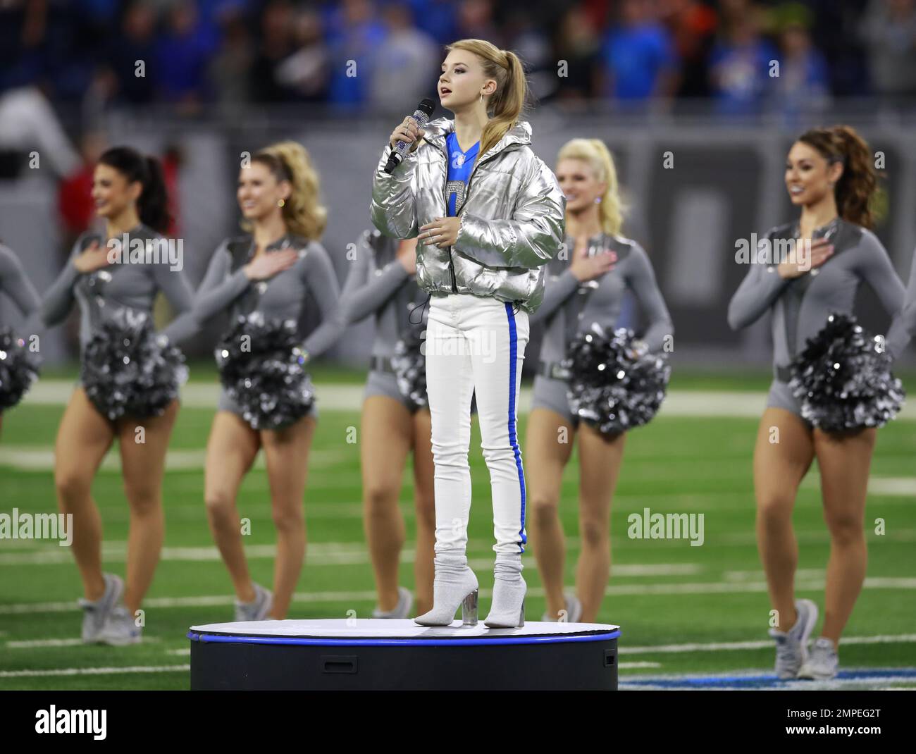 Country singer-songwriter Tegan Marie performs the national anthem ...