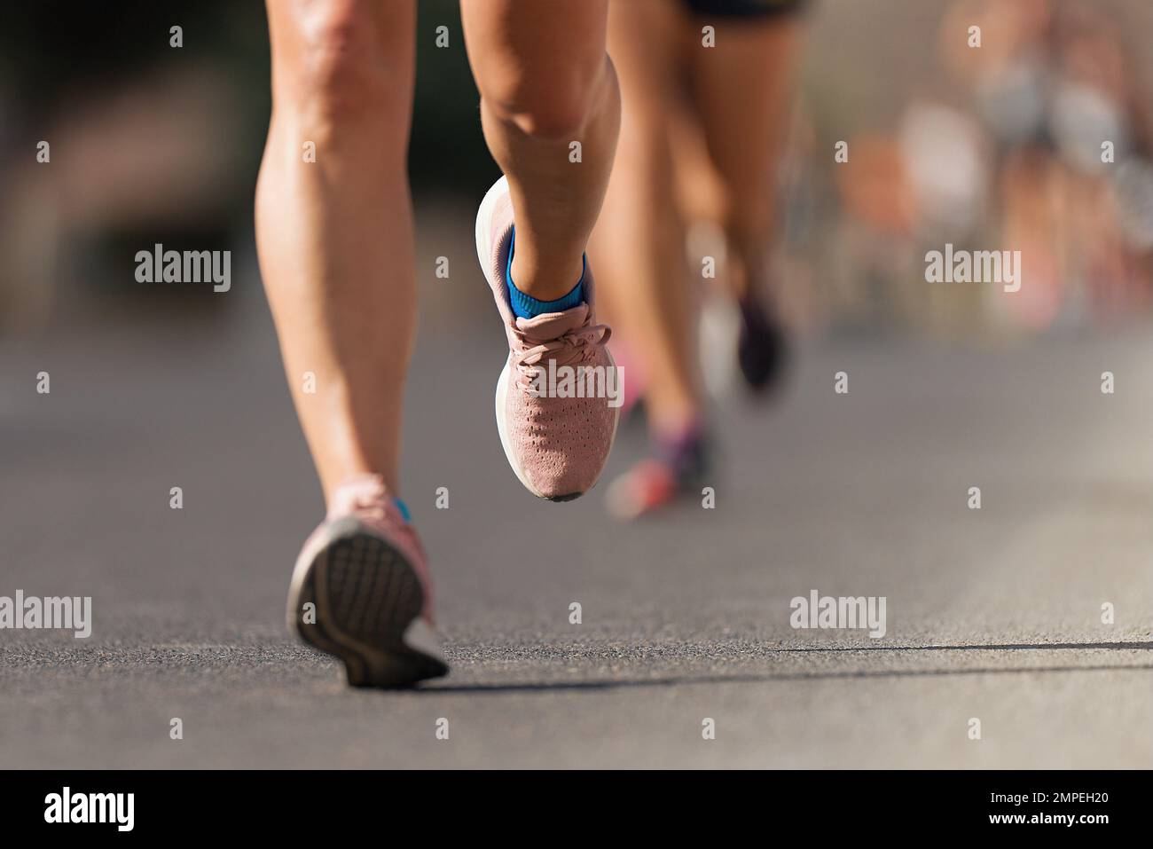 Athlete runner feet running on road close up on shoe , marathon running ...