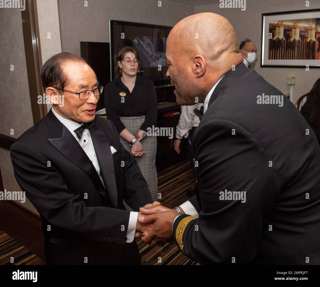 Capt. David Adams, Commander, Fleet Activities Sasebo (CFAS) greets ...