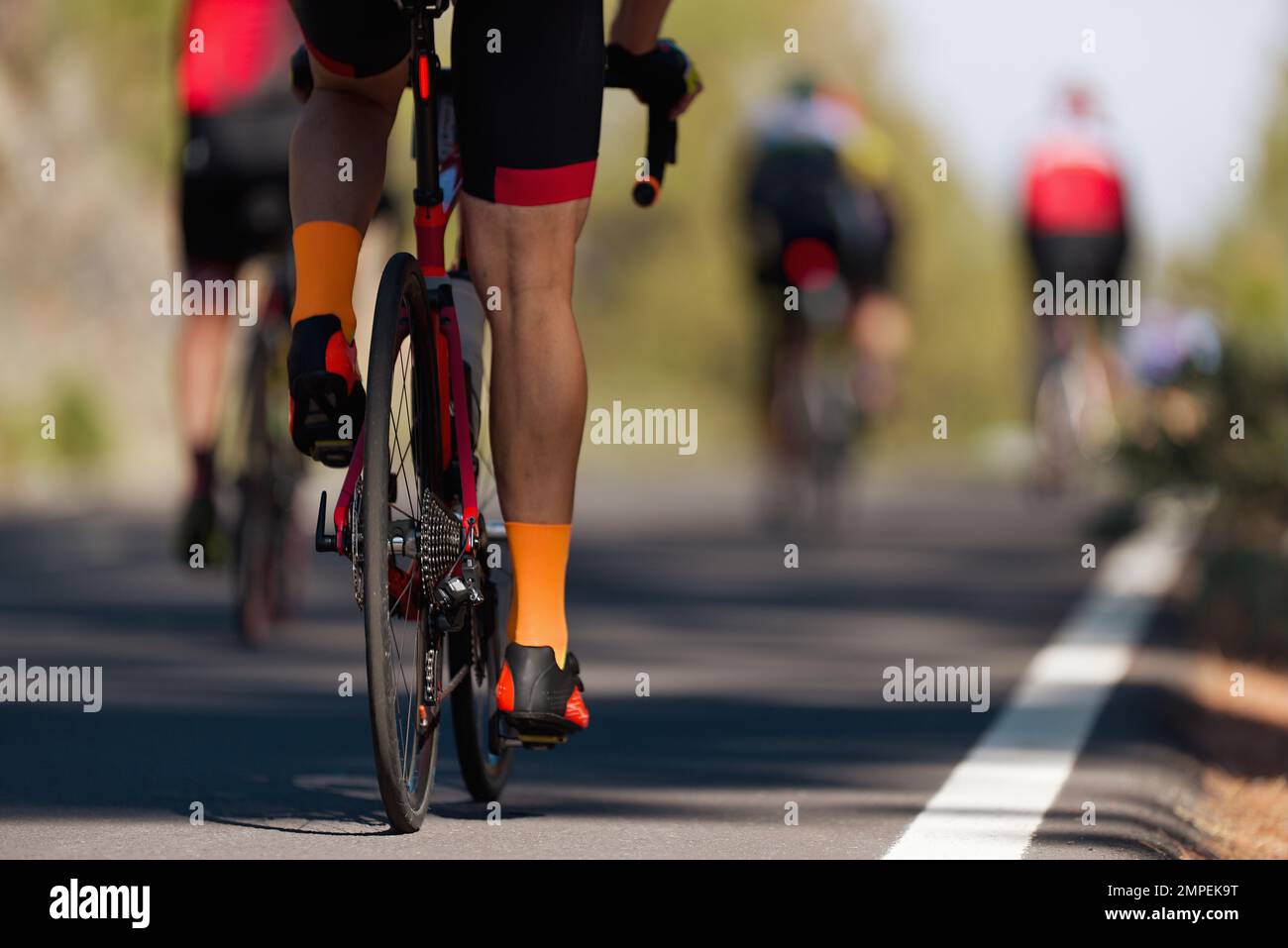 Cycling competition cyclist athletes riding a race at high speed ...