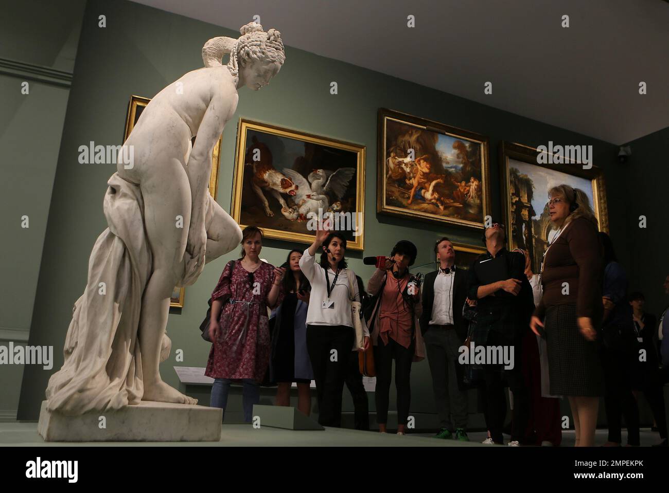 Juliette trey from Louvre Museum of France, 3rd left, explains about ...