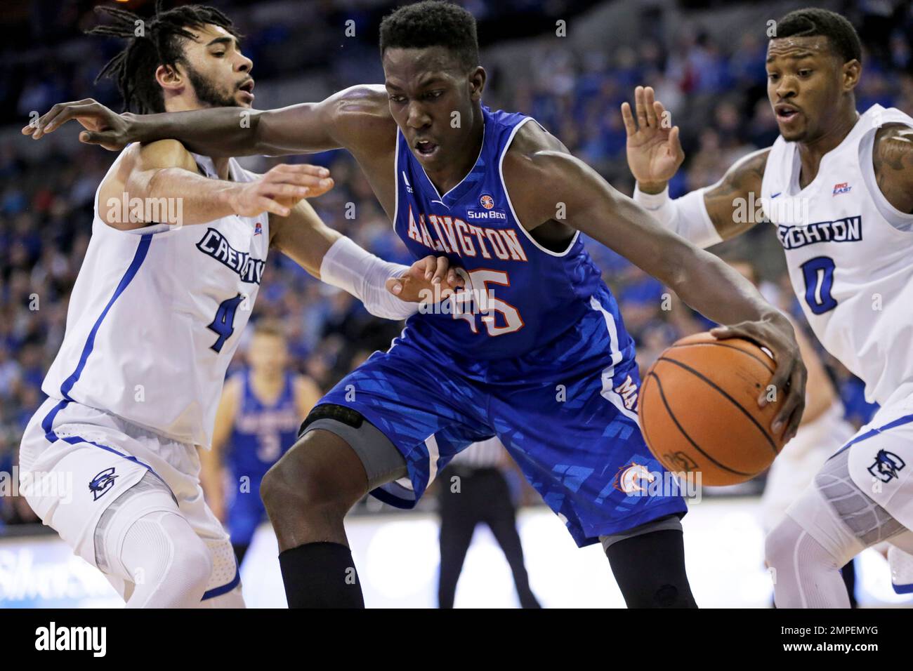 Texas-Arlington's Kevin Hervey (25) is defended by Creighton's Marcus ...