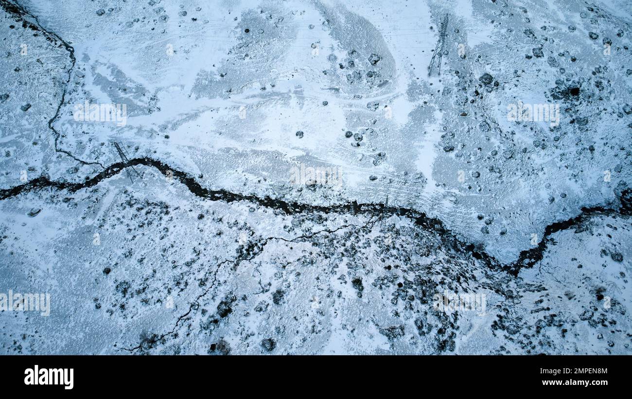 A birds eye view of a river with a field covered by snow Stock Photo ...