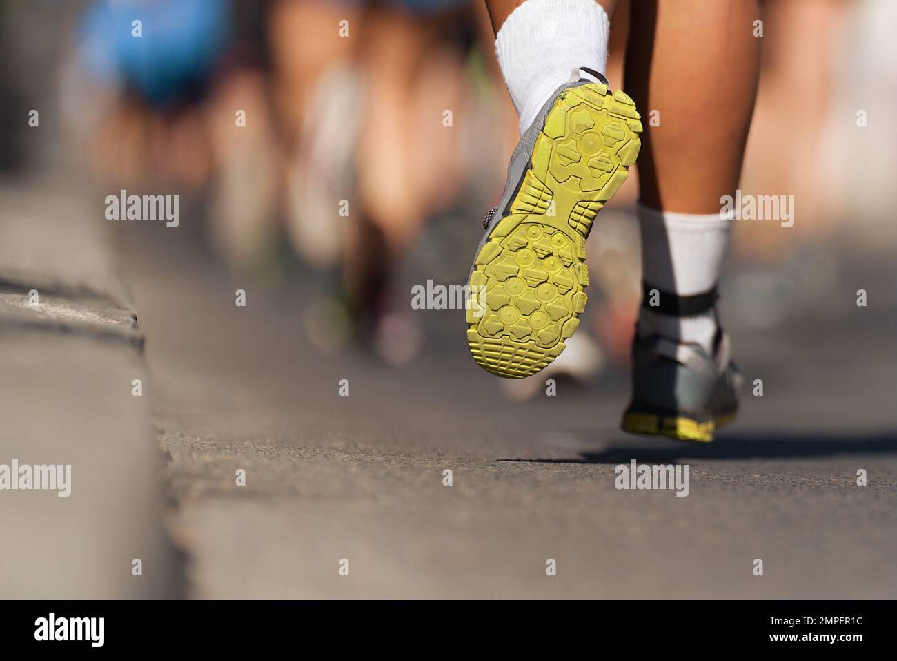 Marathon running race, people feet on city road Stock Photo - Alamy