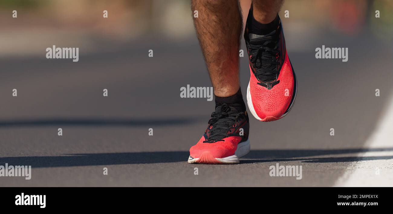 Man running on street asphalt hi-res stock photography and images - Alamy