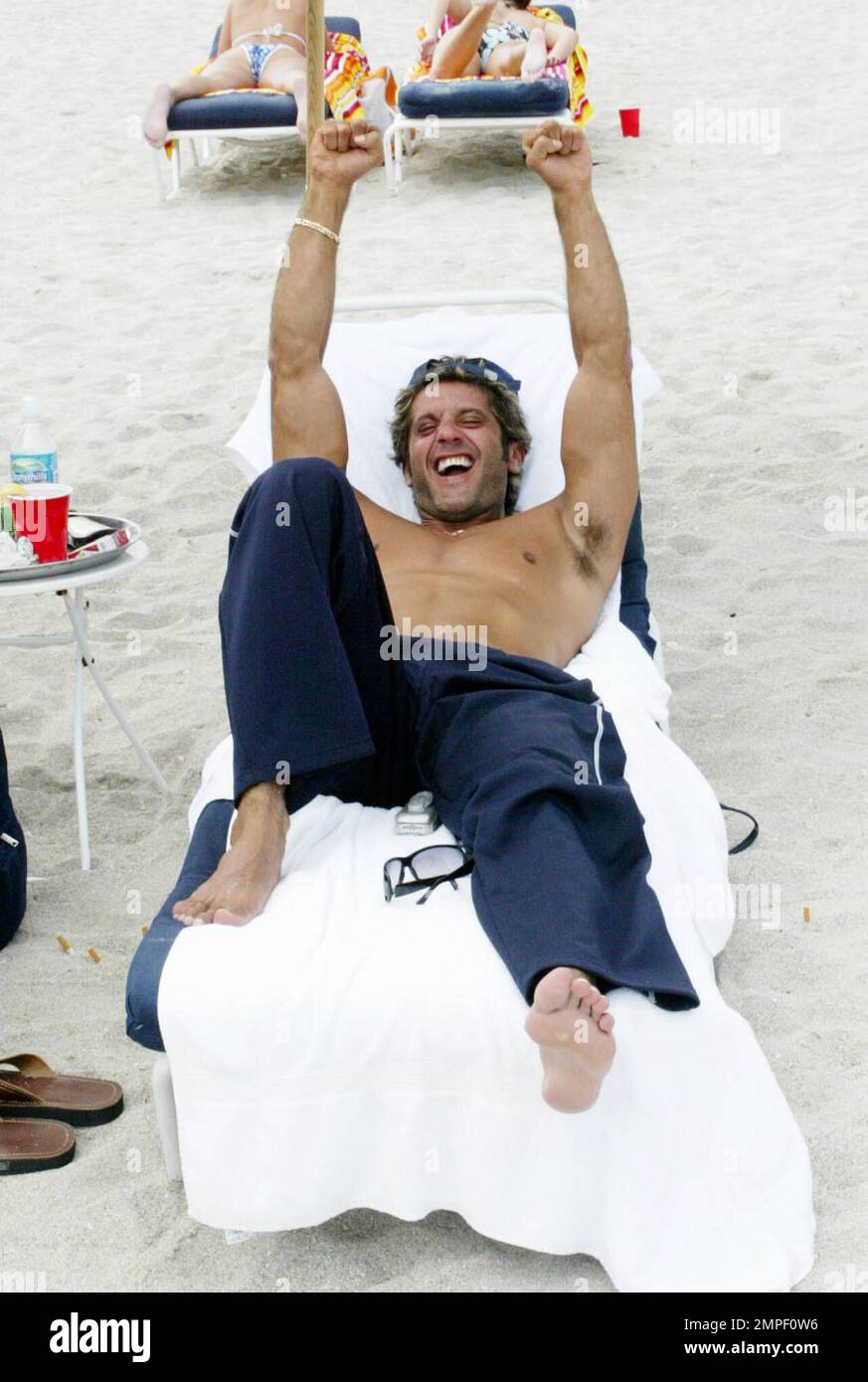 Mexican actor Bobby Larios relaxes in the sun on Miami Beach following ...