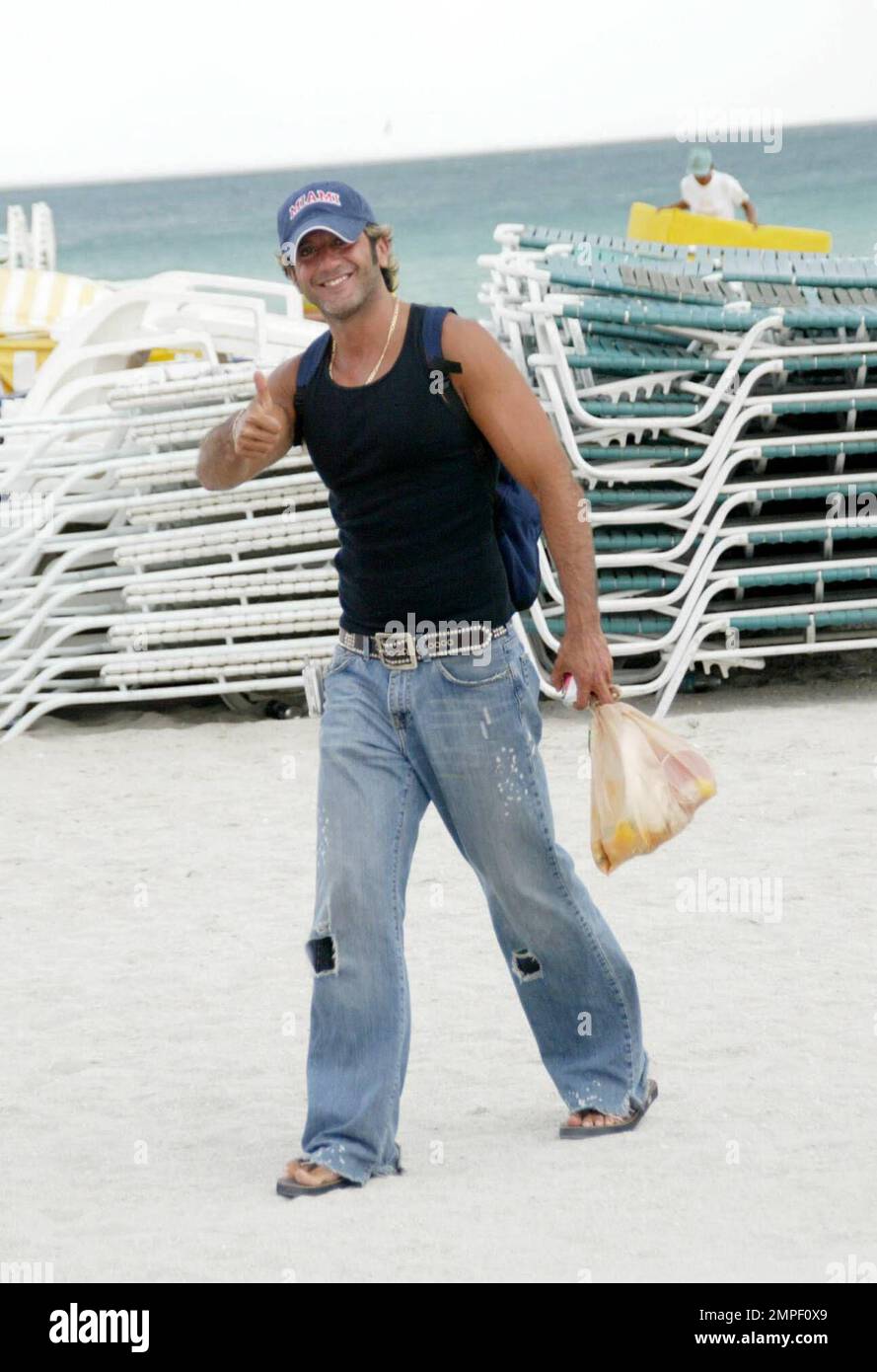 Mexican actor Bobby Larios relaxes in the sun on Miami Beach following ...