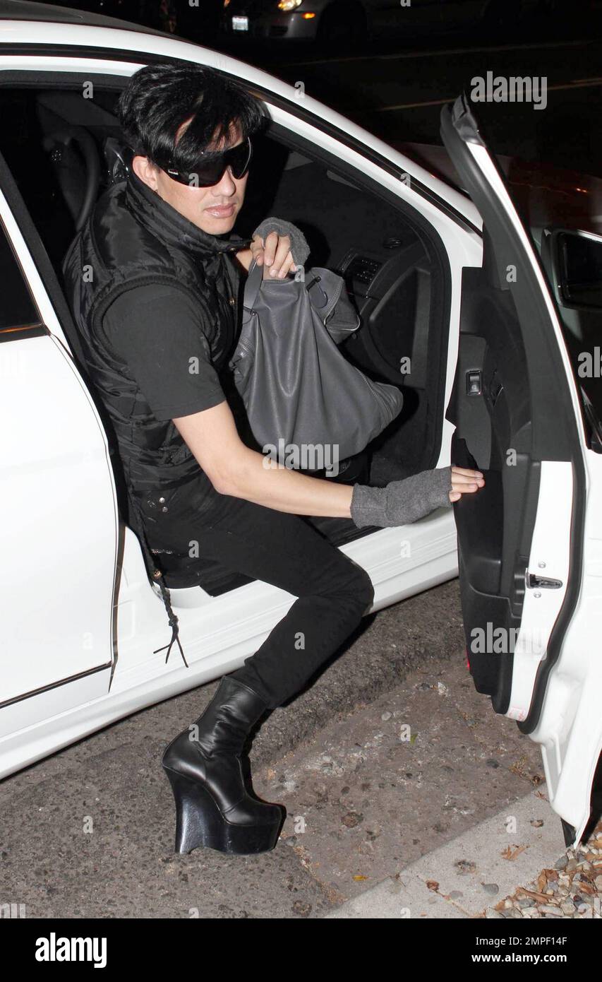 Fashion Designer Bobby Trendy strikes his usual poses in high heels as ...