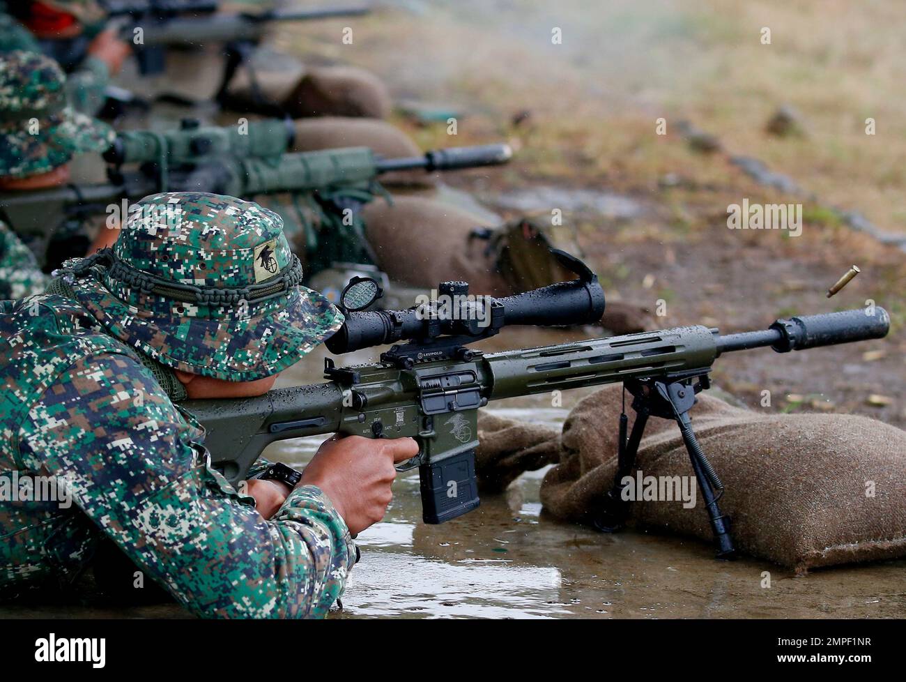 Philippine Marine snipers fire at their targets as they train with ...