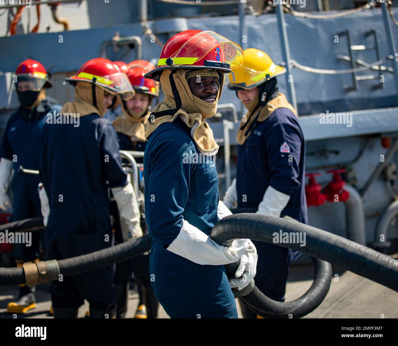 Machinist’s Mate 2nd Class Charles Akogu, assigned to the Arleigh Burke ...