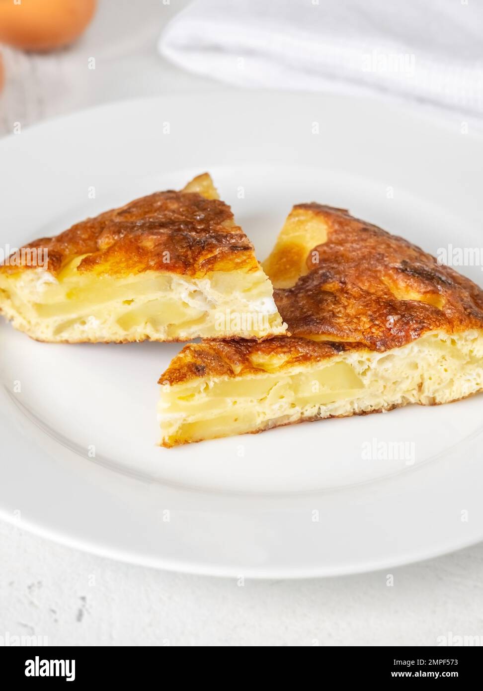 Traditional Spanish tortilla omelette made with eggs and potatoes Stock ...