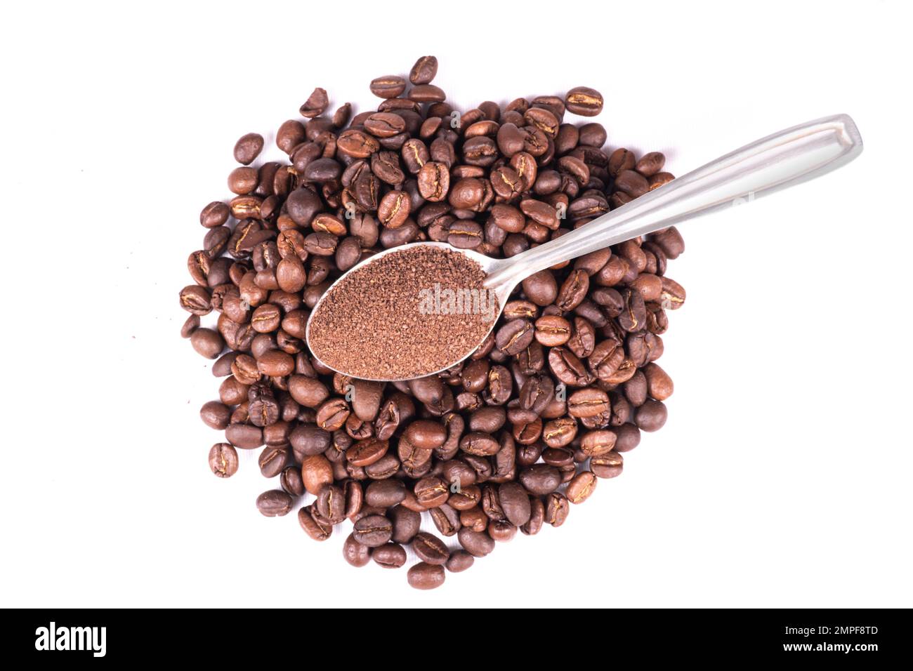 Coffee Powder In Spoon On Heap Of Coffee Bens Isolated On White ...
