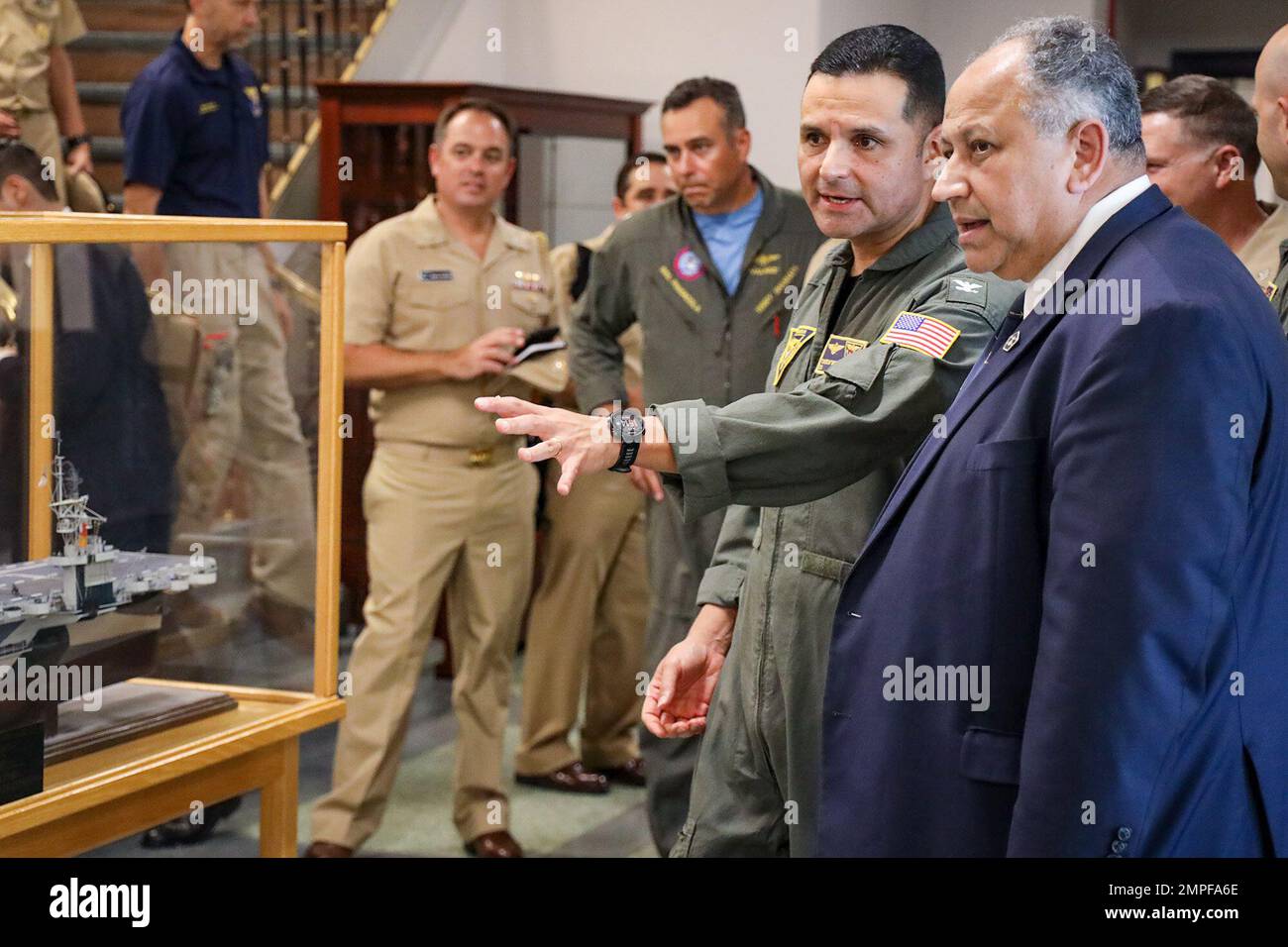 Secretary of the Navy Carlos Del Toro, right, speaks with Capt. Edgardo ...