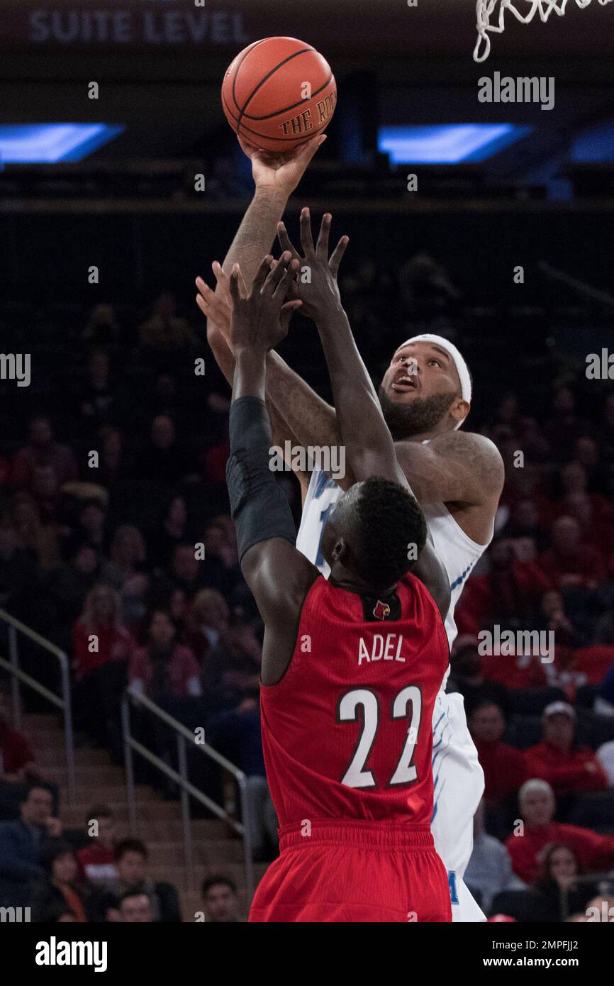 Louisville forward Deng Adel (22) guards Memphis forward Mike Parks Jr ...