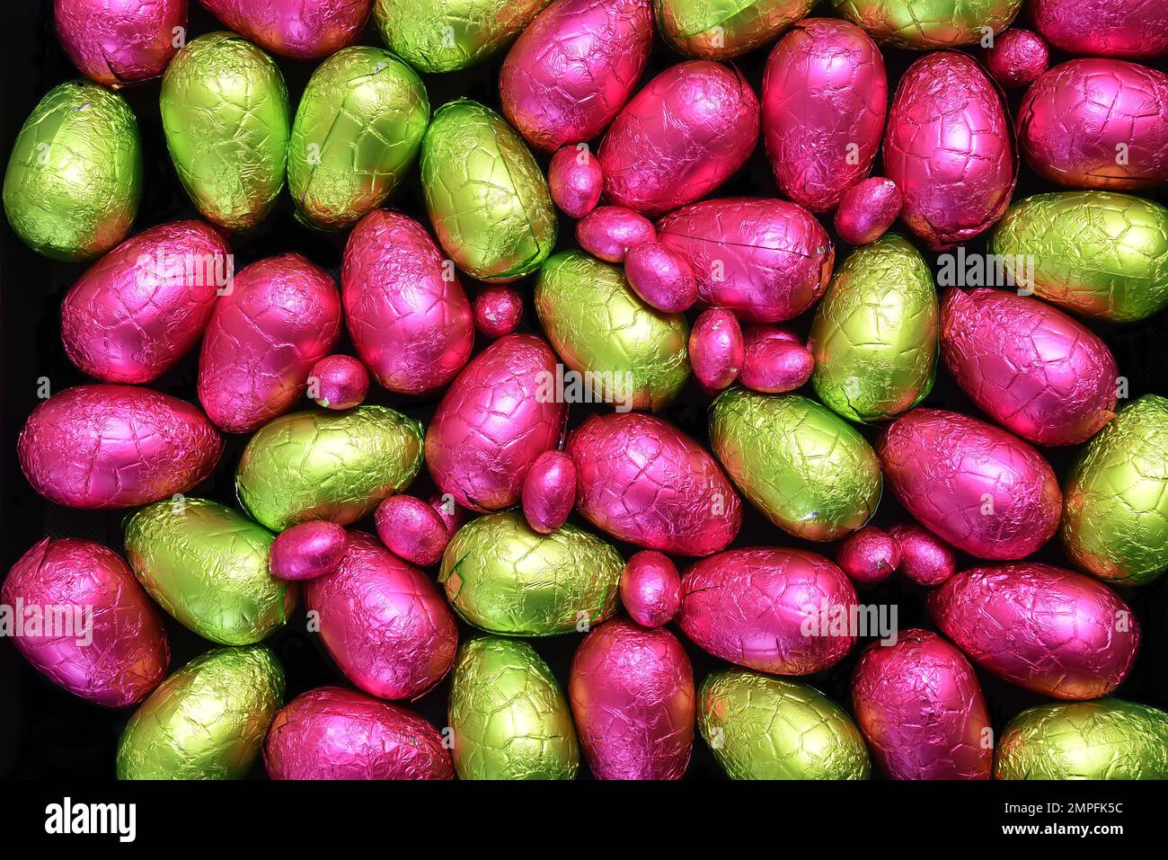 Pile or group of multi colored and different sizes of colourful foil ...