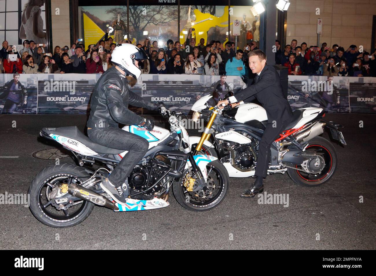 Jeremy Renner arrives on a motorcycle at the premiere of "The Bourne ...