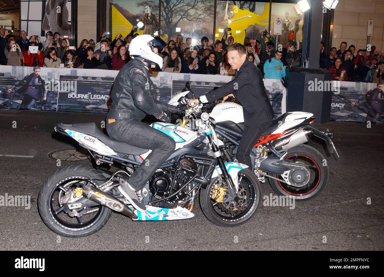 Jeremy Renner arrives on a motorcycle at the premiere of "The Bourne ...