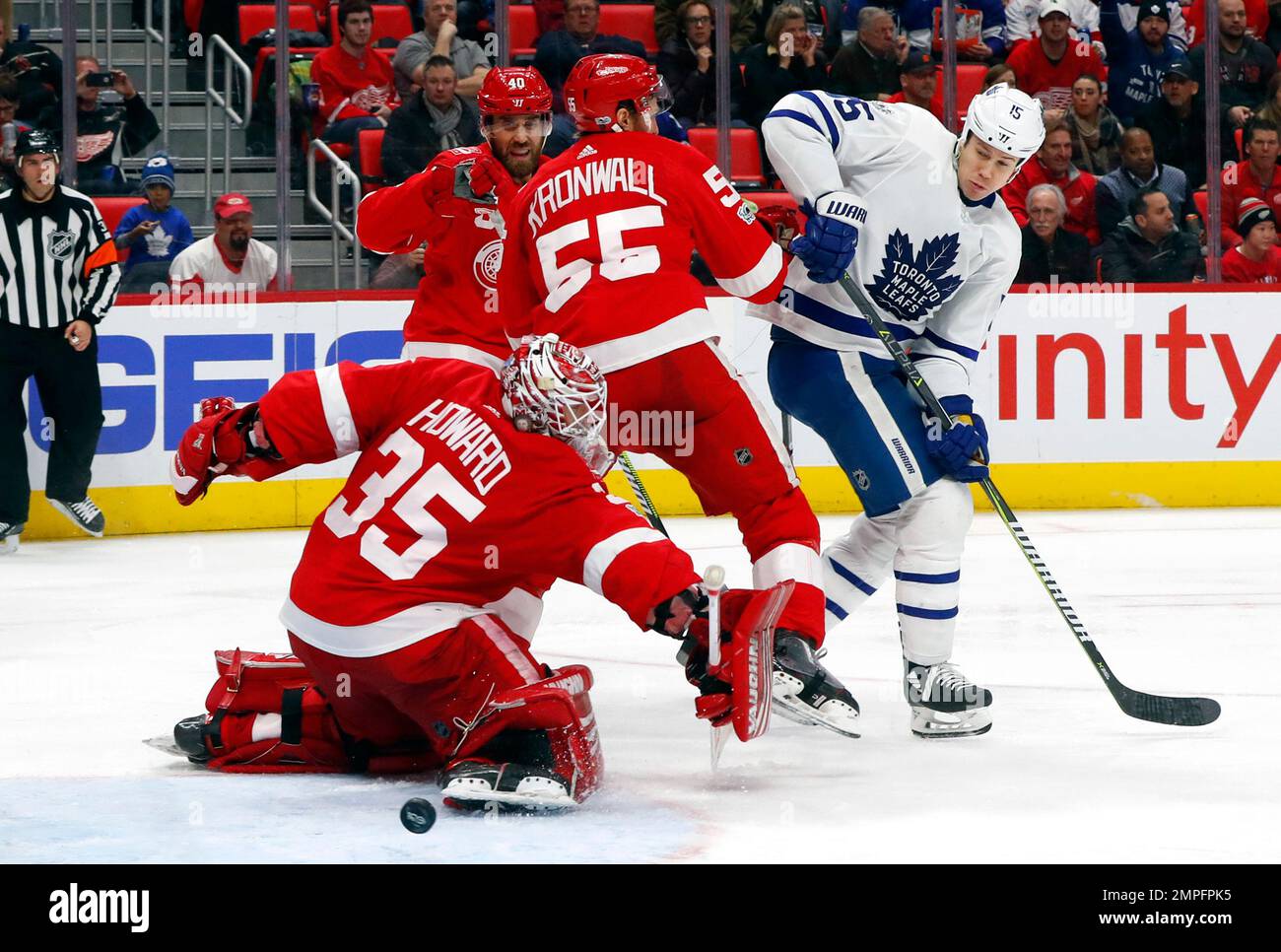 Detroit Red Wings goalie Jimmy Howard (35) deflects a shot by Toronto ...