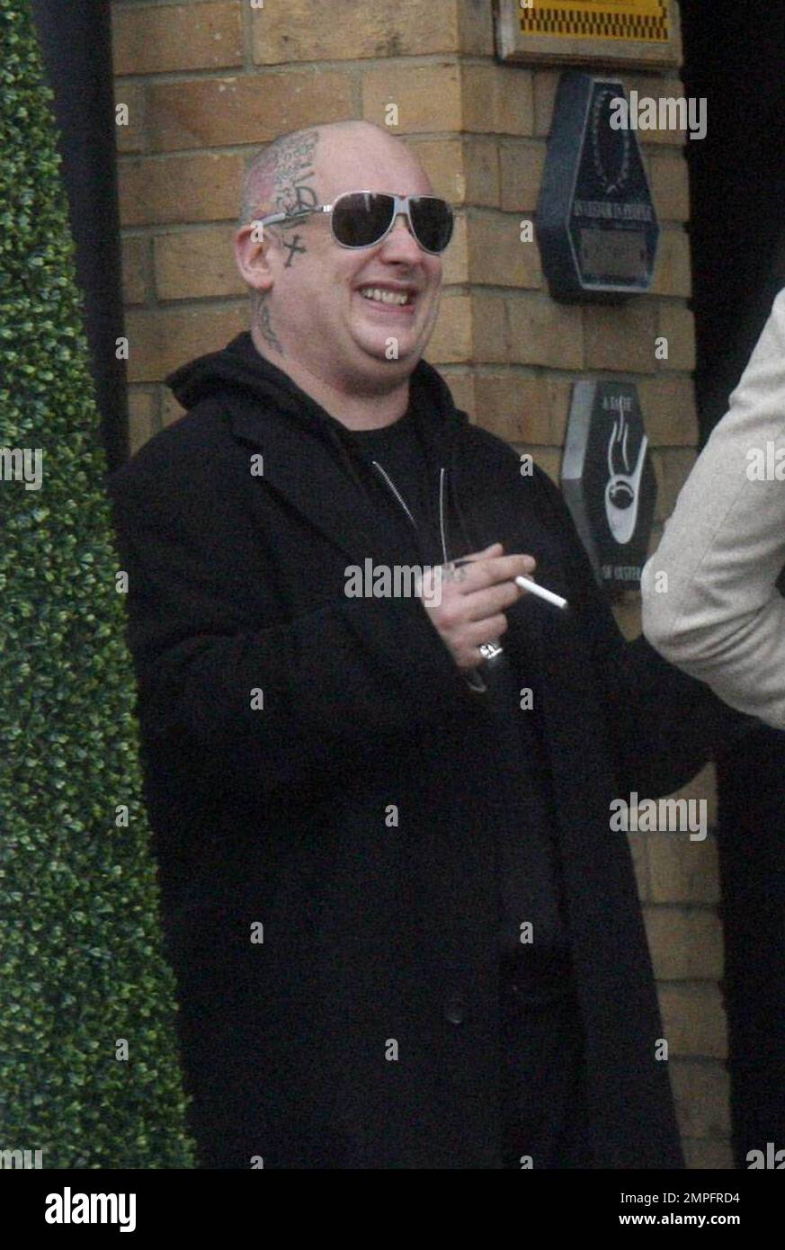 EXCLUSIVE!! Boy George covers his face with his hood as he walks with ...