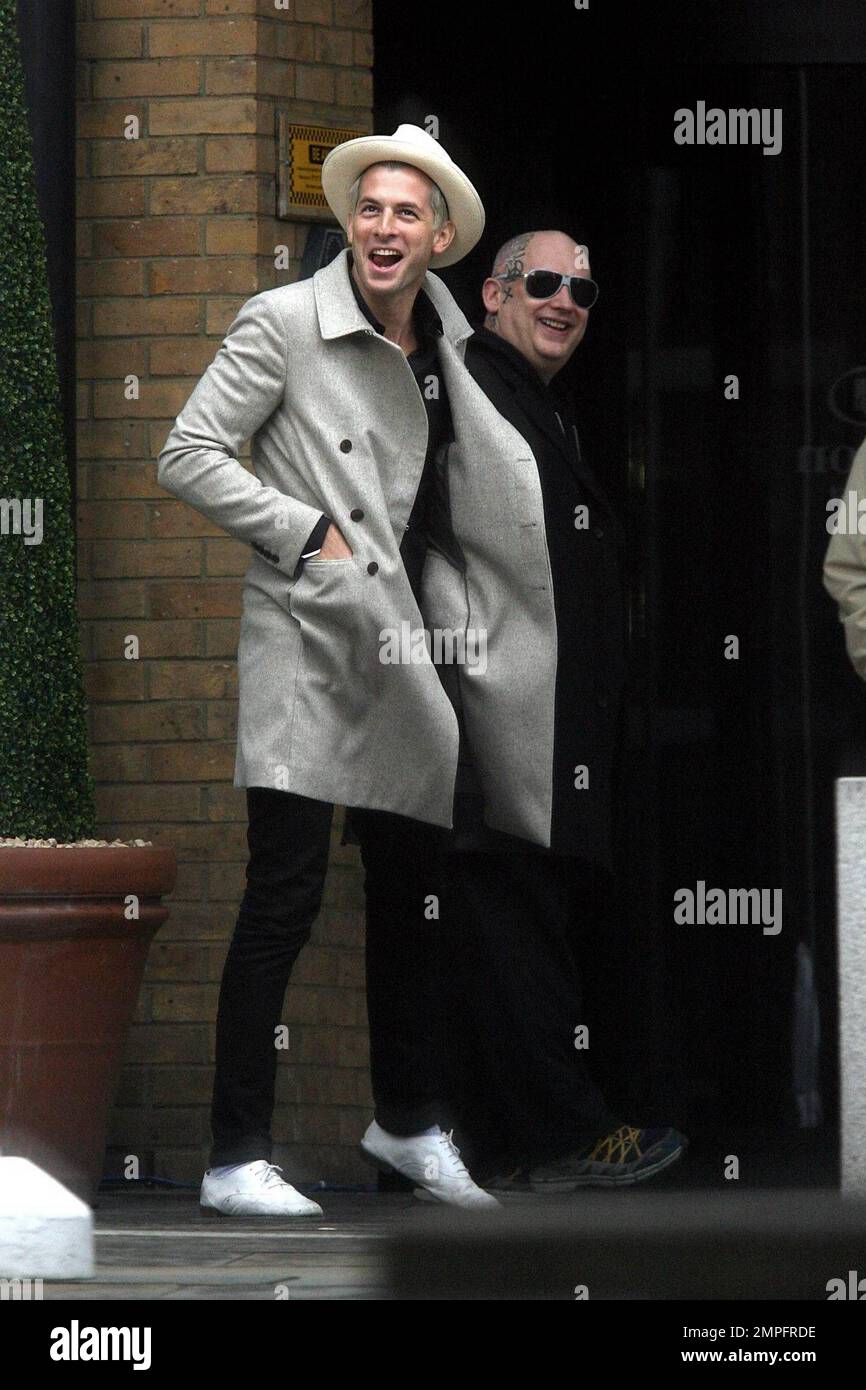 EXCLUSIVE!! Boy George covers his face with his hood as he walks with ...