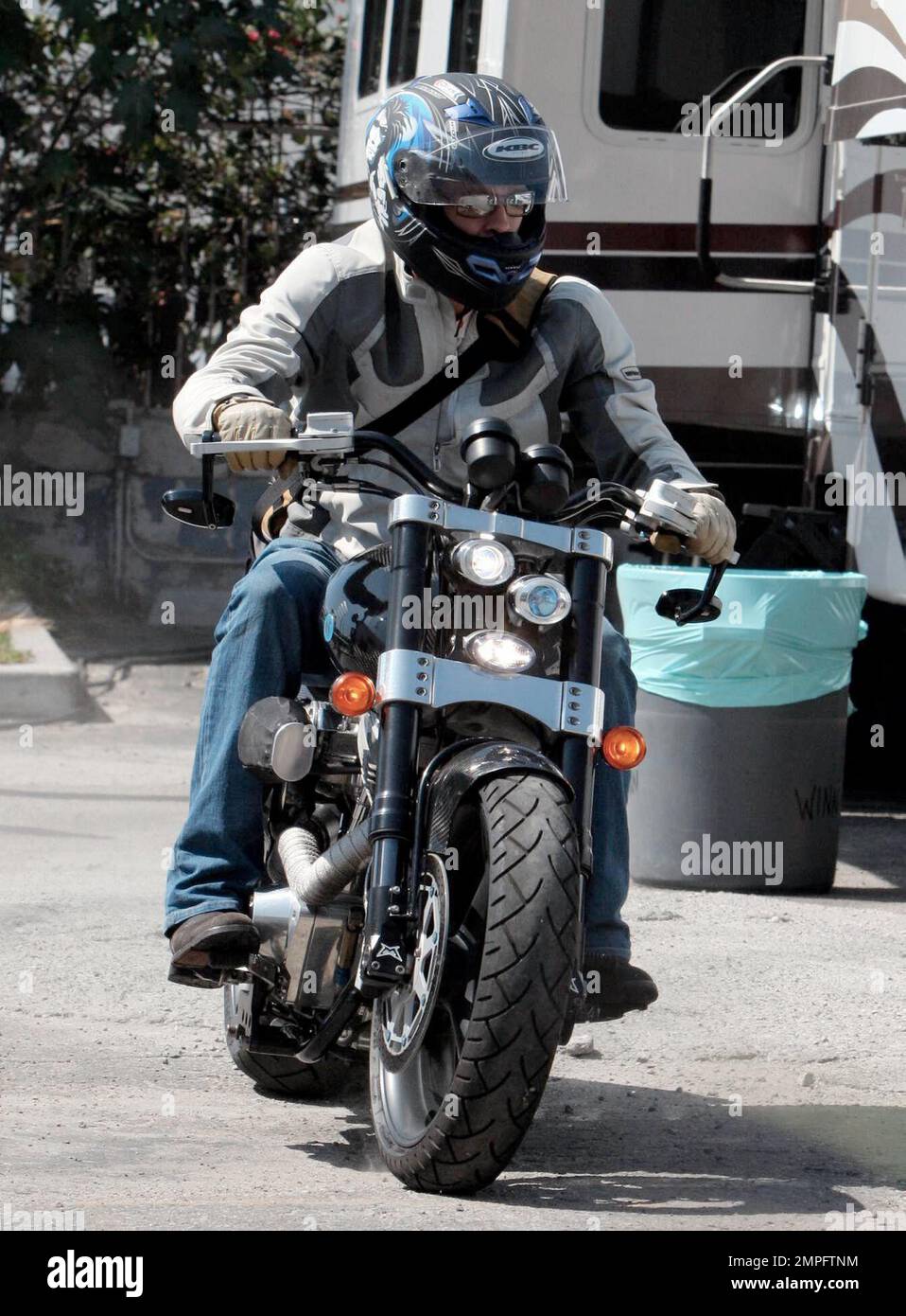Brad Pitt zooms off the set of Oceans Thirteen on his motorcycle and ...