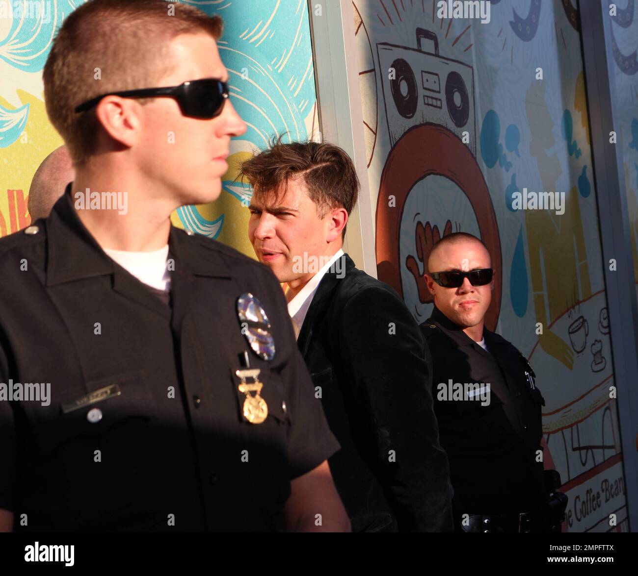 Ukrainian TV reporter Vitalii Sediuk is seen being hauled away by LAPD ...