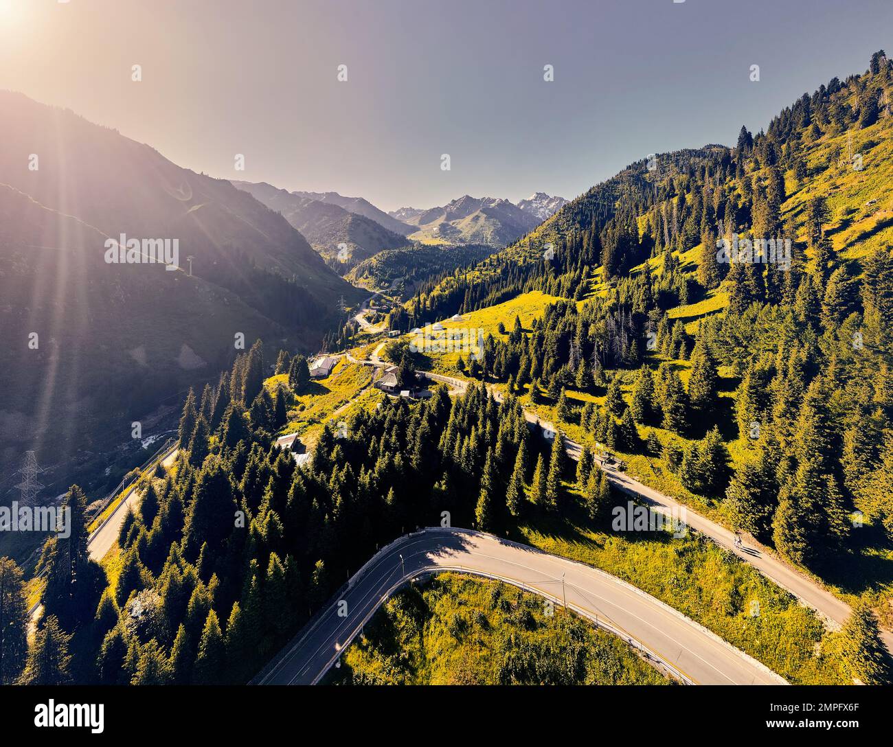 Beautiful scenery of the mountains with snow glacier and road and river ...