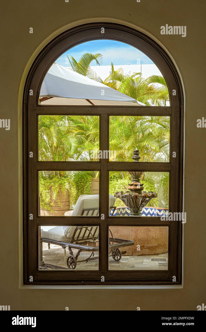 View through window to the patio of the VIPs guest room at Casa ...