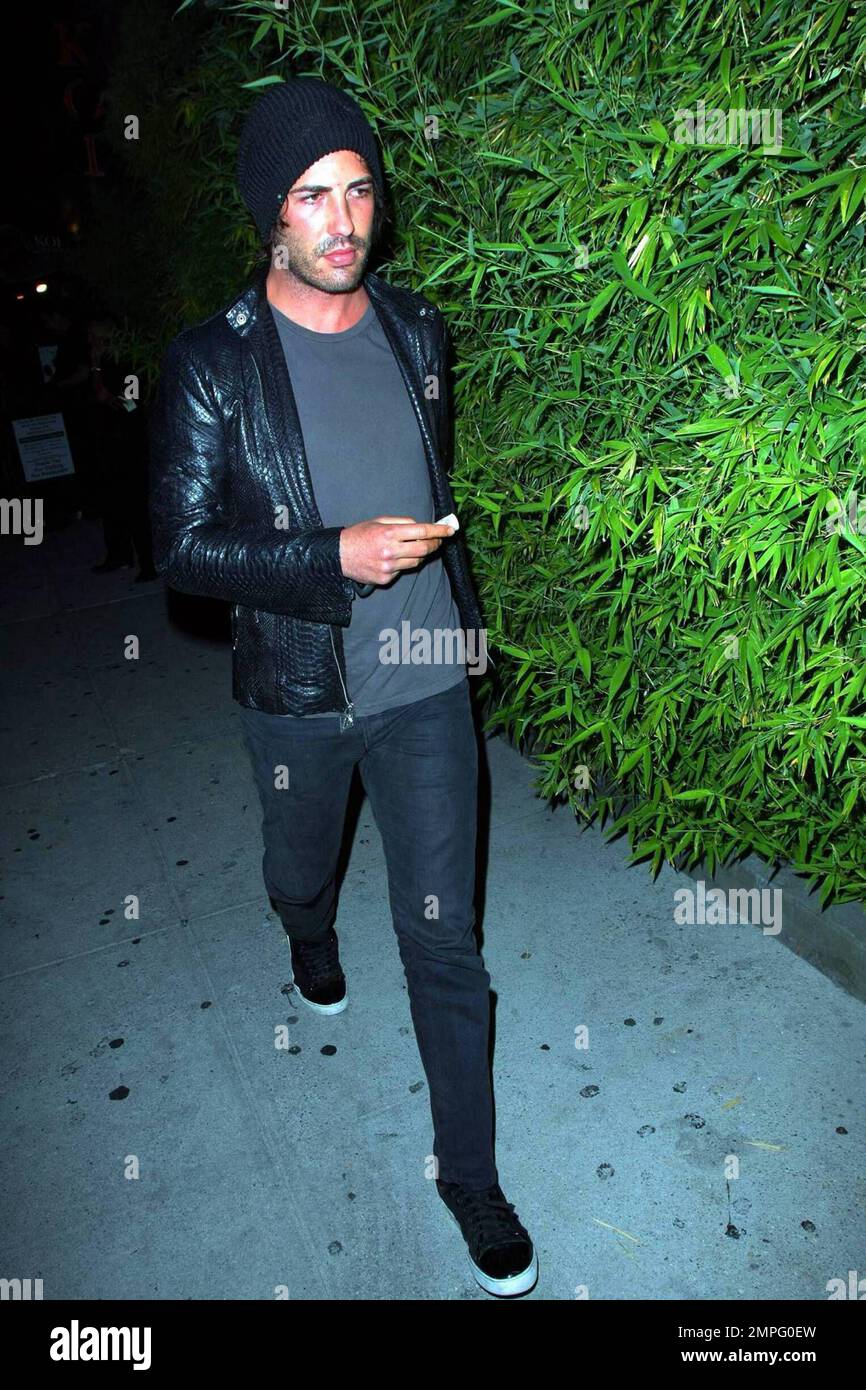 Brandon Davis carries along his cigarettes as he heads out for a Friday ...