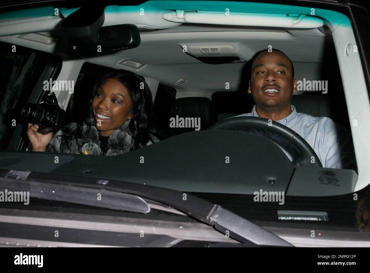 R&B singer and actress Brandy turns the tables on photographers as she ...