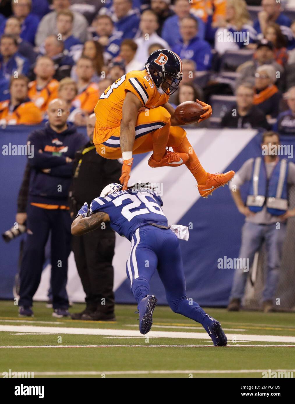 Denver Broncos running back Devontae Booker (23) leaps over Indianapolis Colts free safety ...