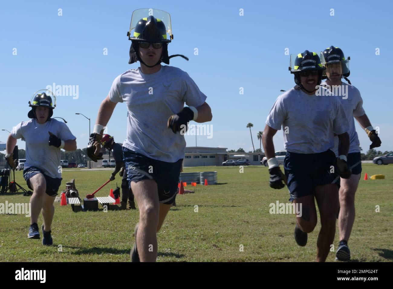 Members of “Team Beast Mode” sprint to the finish line during the Fire ...