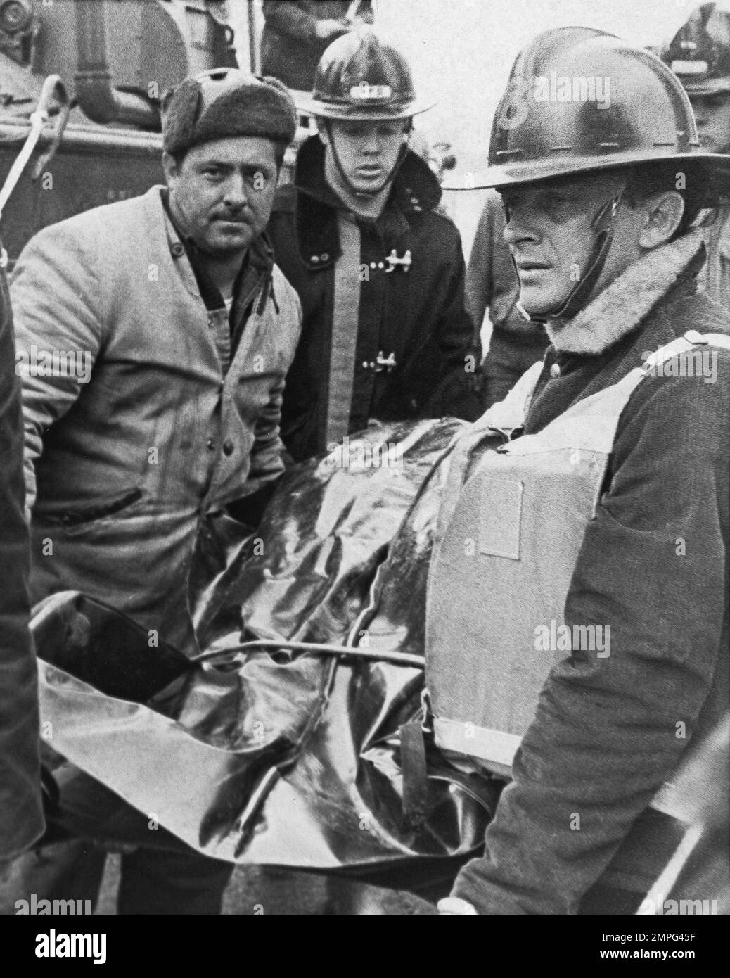 FILE - In this Dec. 15, 1967 file photo, rescuers take a body to a ...