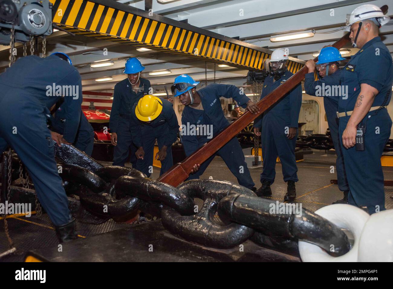 221014-N-UF592-1055 MANILA BAY (Oct. 14, 2022) Sailors wedge a cable ...