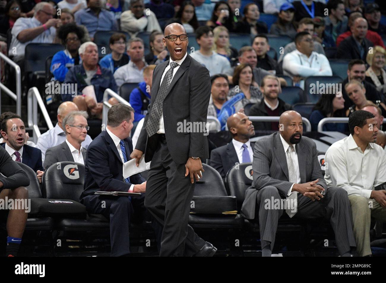Los Angeles Clippers assistant coach Sam Cassell, center, reacts on the ...