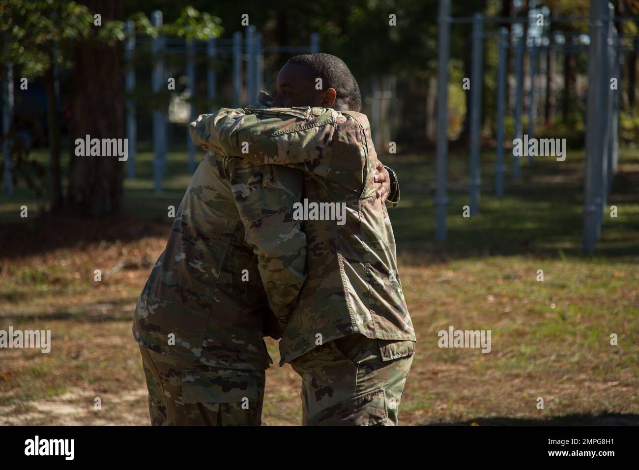 U.S. Army Sgt. Nathaniel Hendrix, left, hugs Staff Sgt. Lionel Hunter ...