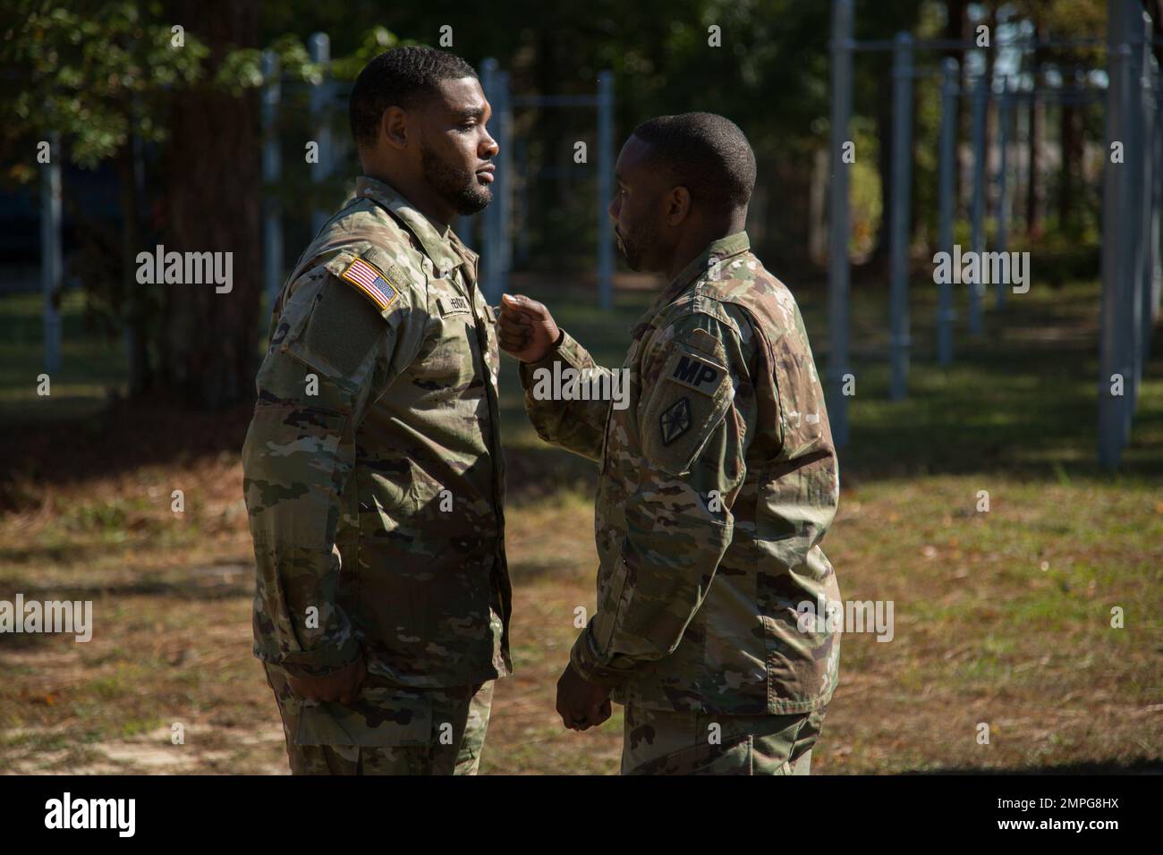 U.S. Army Staff Sgt. Lionel Hunter, right, promotes Sgt. Nathaniel ...